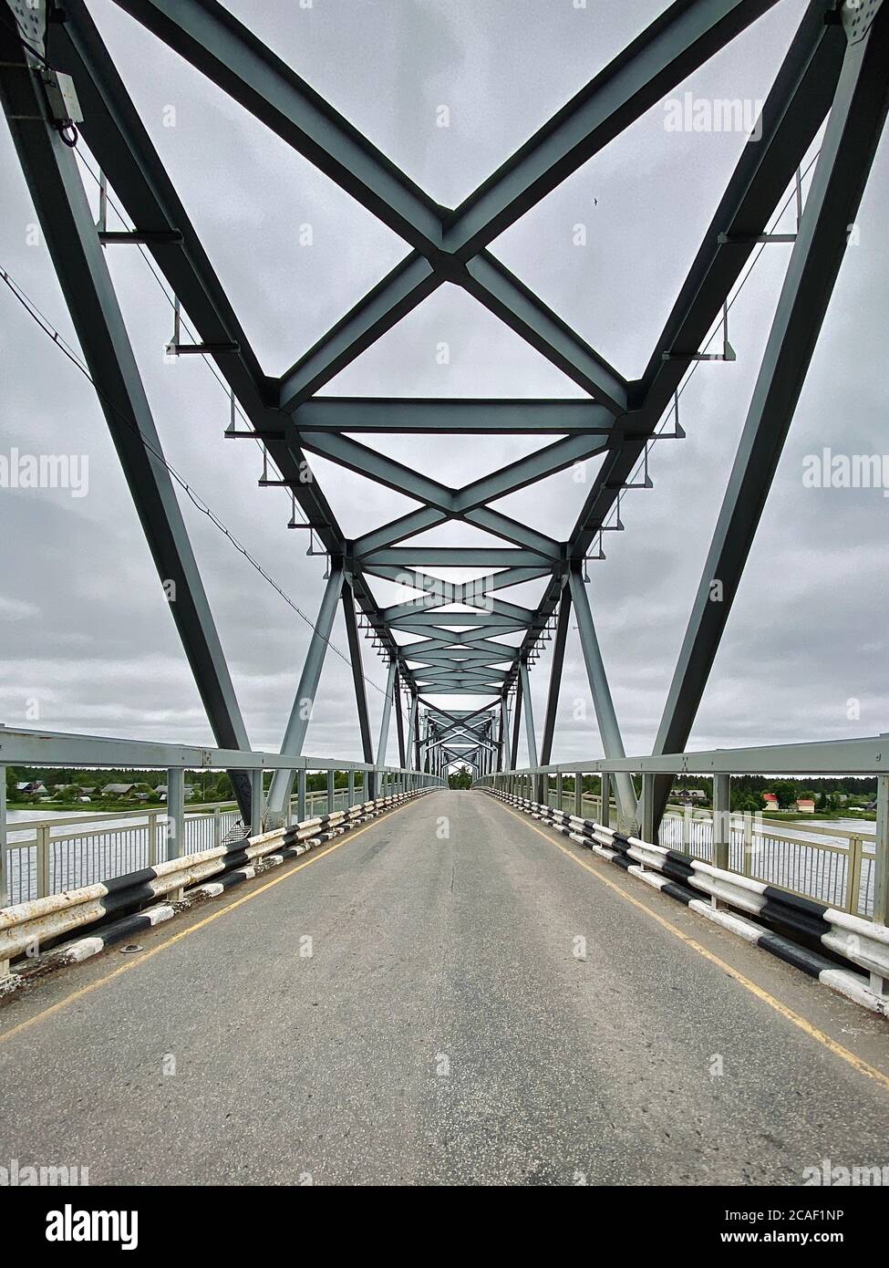 view of the truss bridge in the middle of the road Stock Photo - Alamy