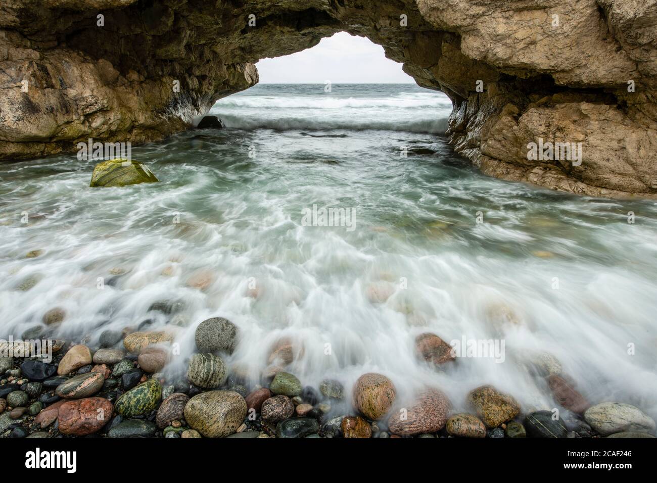 Surf and rocks under the Arches, Arches Provincial Park, Newfoundland ...