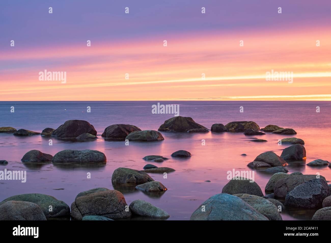 Beach stones at sunset near Green Point, Gros Morne National Park ...