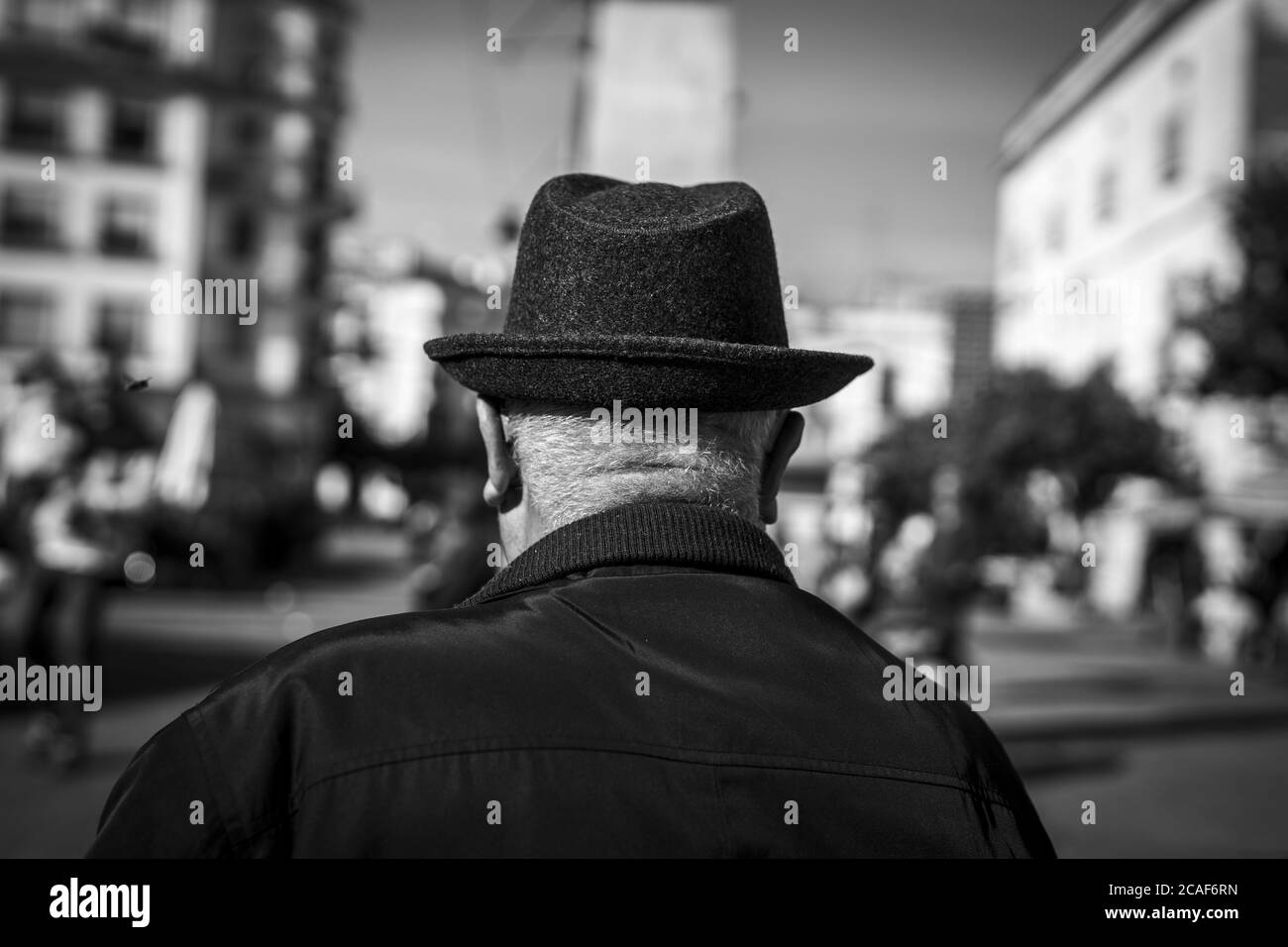 Man from behind with cap Black and White Stock Photos & Images - Alamy