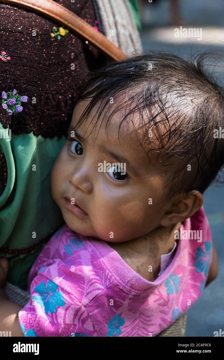 A Mayan baby at the ruins of the Mayan city of Palenque, Palenque ...