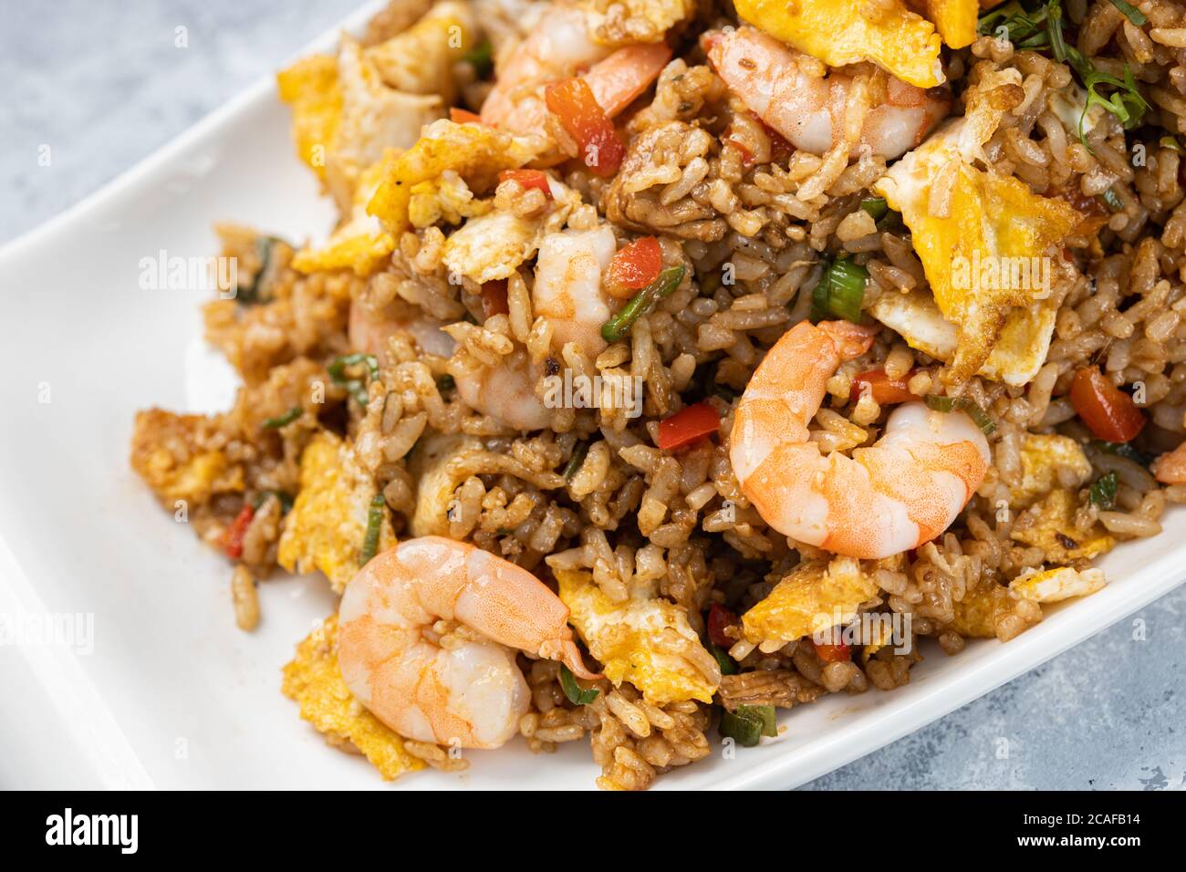 High angle view of spicy cooked rice with meat, shrimp and vegetables ...