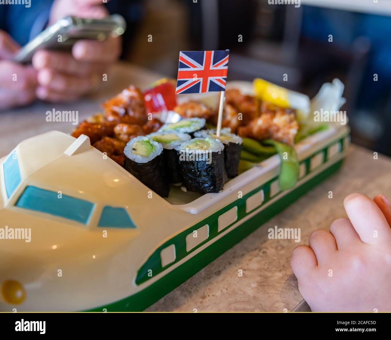 Japanese Boat Bento Box with Avocado Sushi Chicken Background Blur and ...