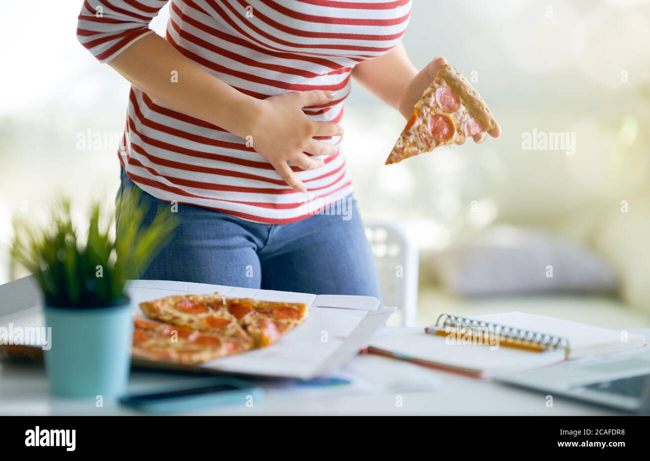 Unhealthy eating at desk hi-res stock photography and images - Alamy