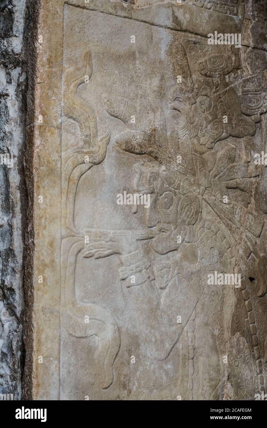 A carved stone panel in the Temple of the Cross showing the cigar ...
