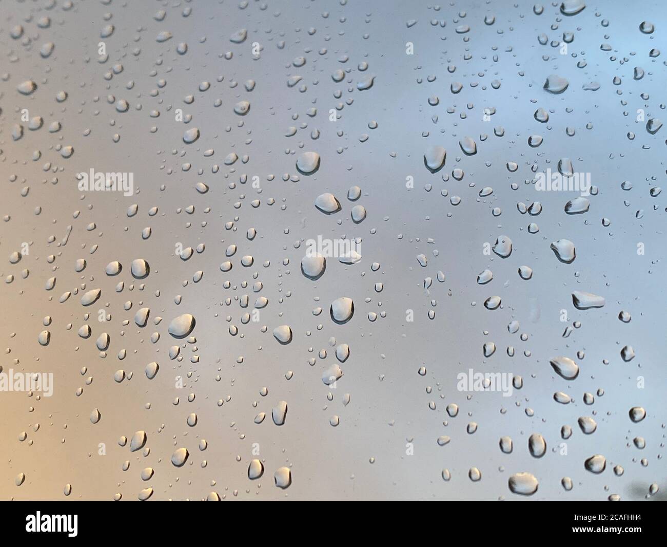 Water droplets on the glass with a background Stock Photo - Alamy