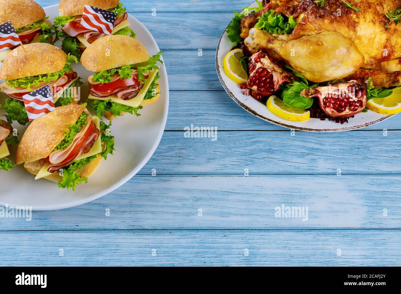 Celebration american holiday with sandwiches and roasted chicken ...