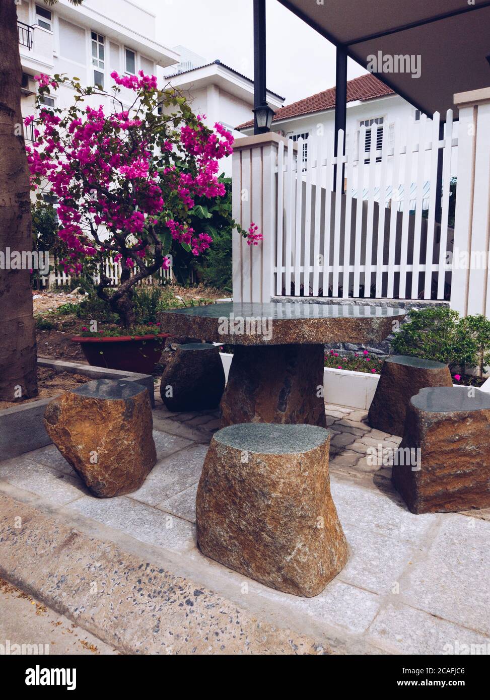 Outdoor tables made of cement and gray brown stone. Rustic vintage ...