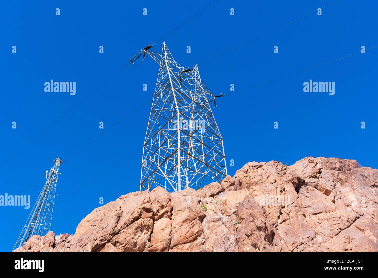 High voltage transmission towers with parallel lines on the top of the ...