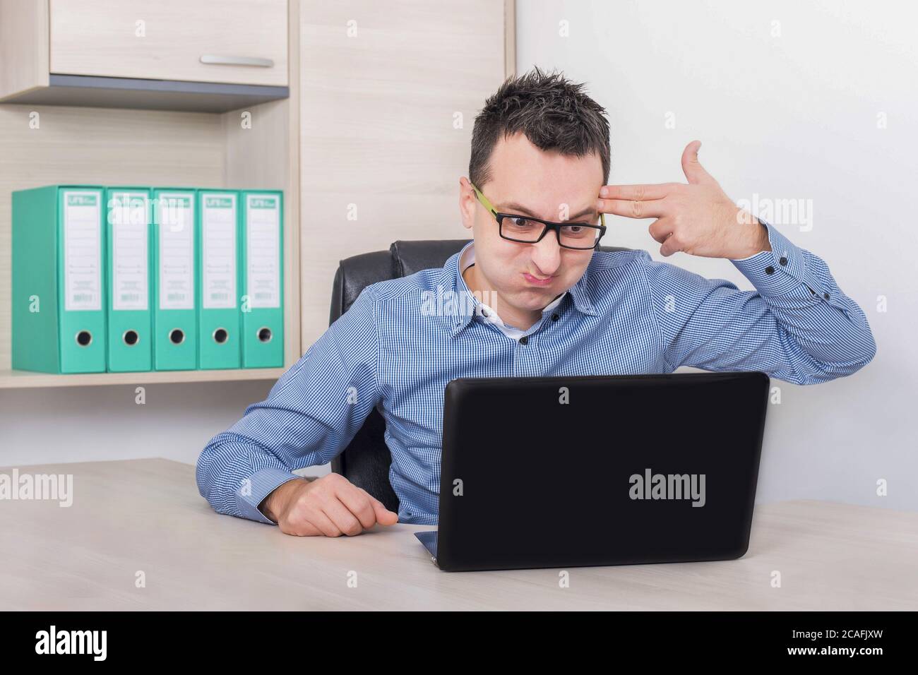 Angry man behind screen hi-res stock photography and images - Alamy