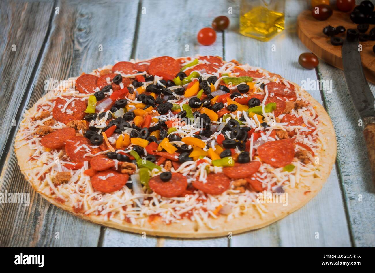 Supreme pizza with black olives, onions, sausage and peppers Stock ...