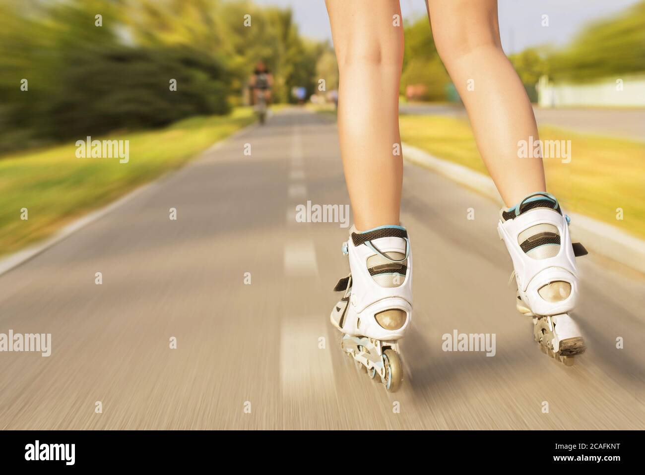 Female legs in roller skates hi-res stock photography and images - Alamy