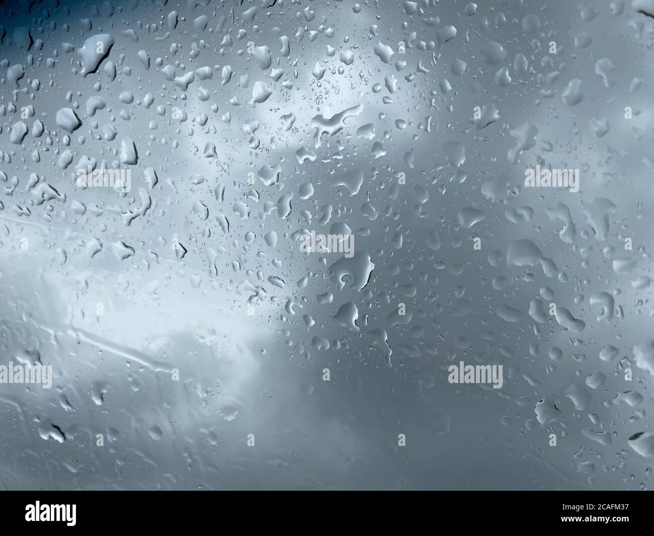 Water droplets on the glass with a background Stock Photo - Alamy