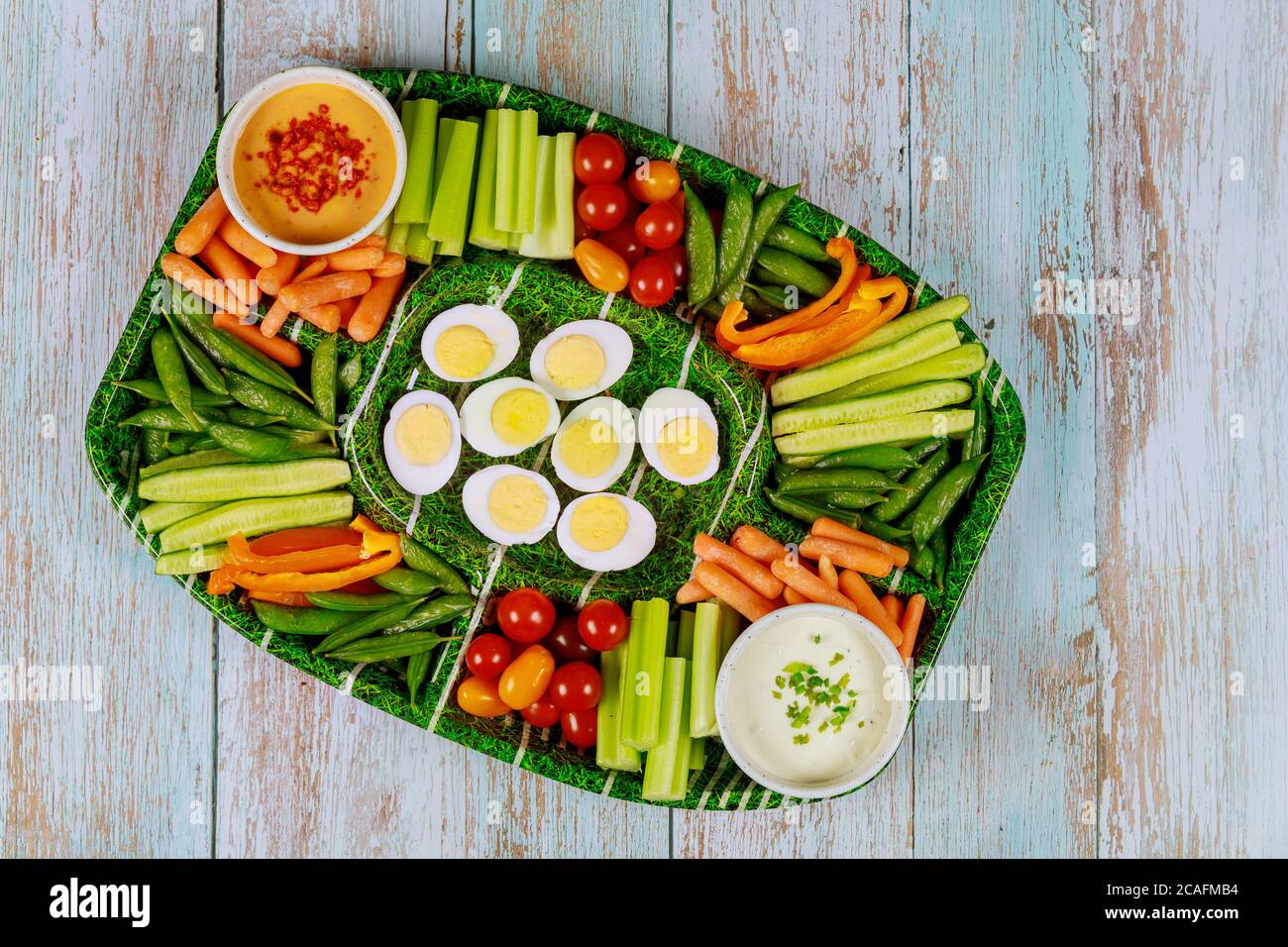 Healthy vegetable platter with hot mayo dipping and ranch close up ...