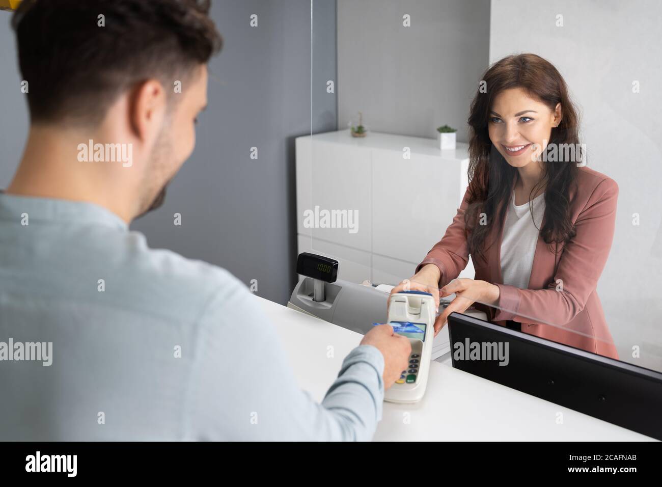Store Shop Cashier Or Hotel Reception Woman Taking Credit Card Payment ...