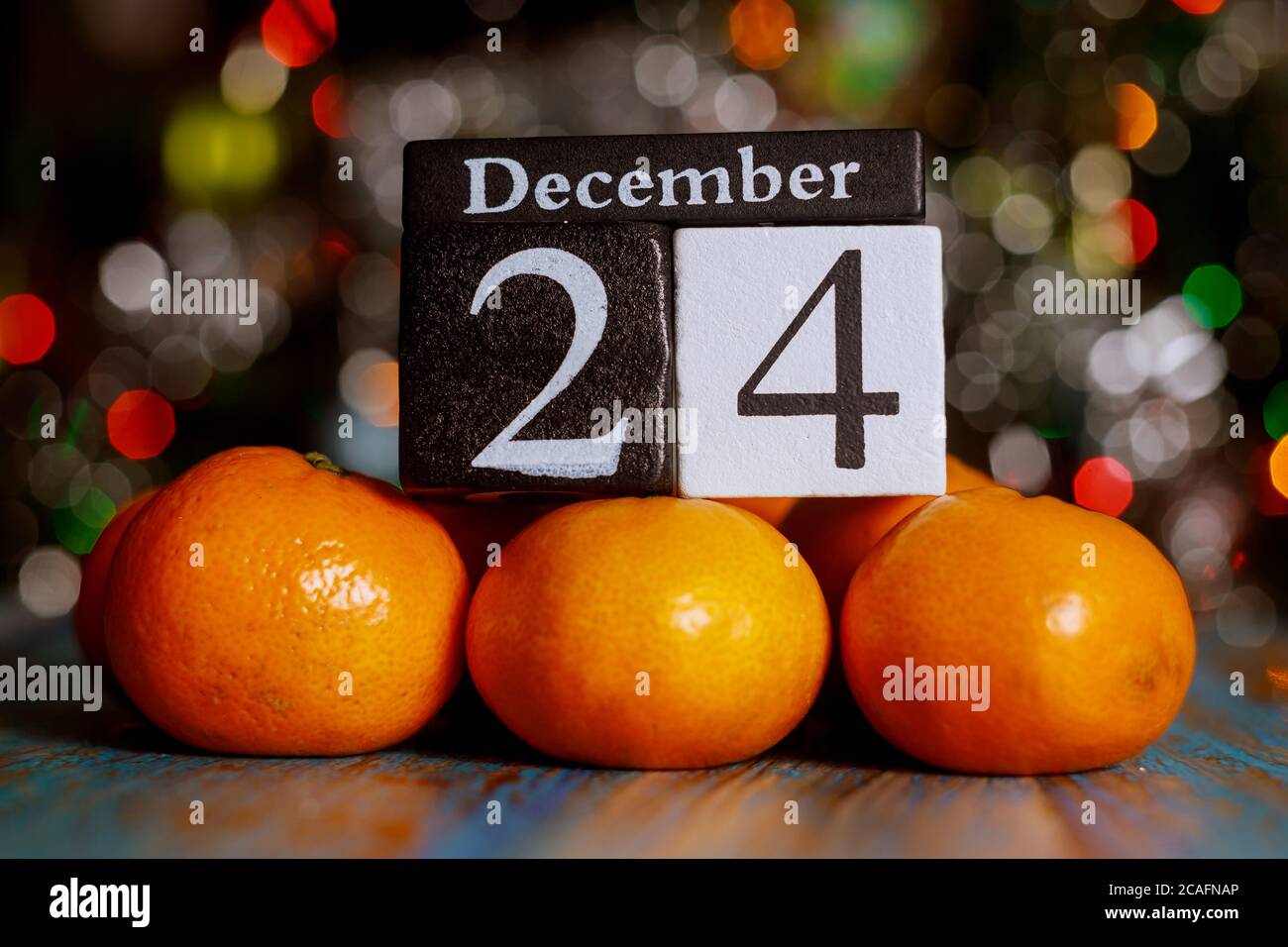 Christmas eve, December 24 th wooden cube calendar with tangerines on ...
