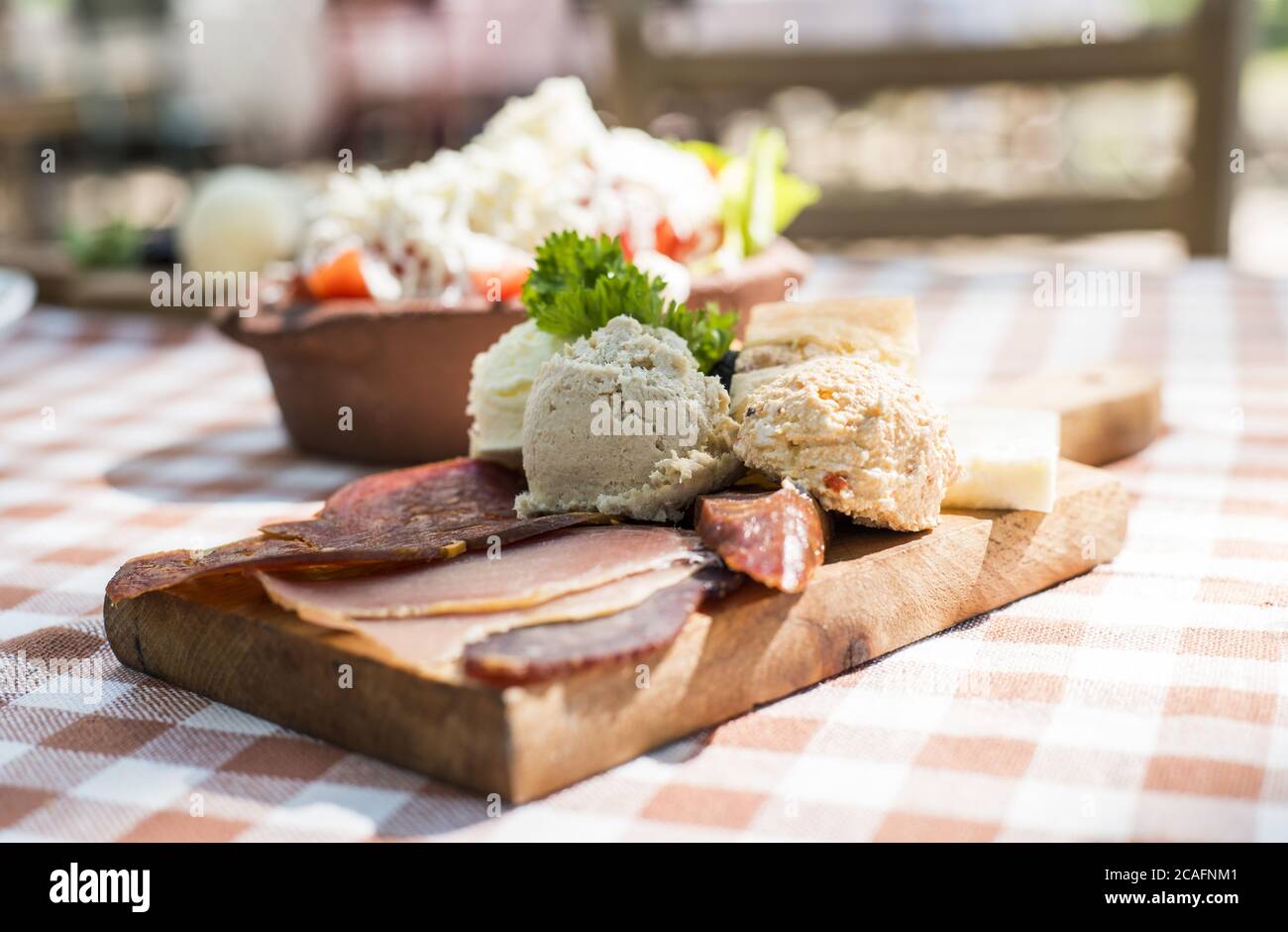 Closeup shot of tasty looking rural food on a wooden board Stock Photo ...