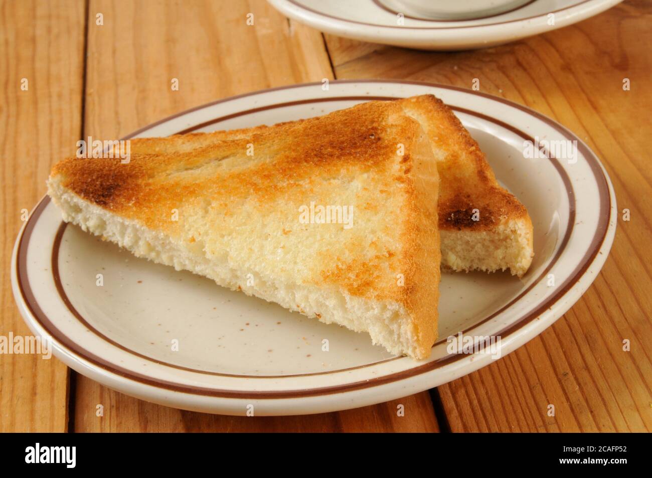 Hot buttered Texas toast on a rustic wooden table with coffee Stock ...