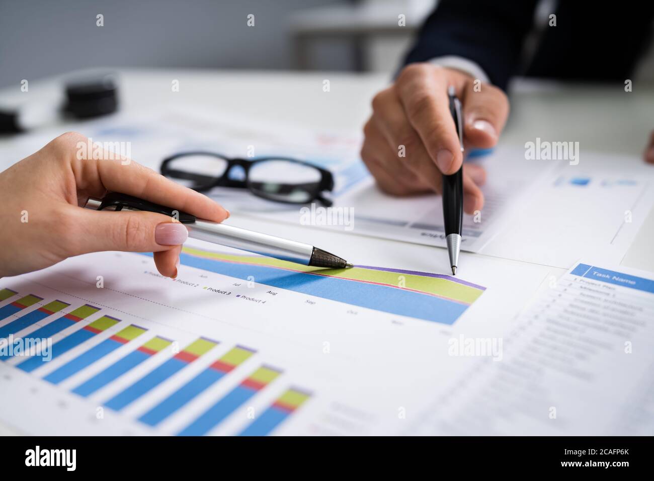 Financial Advisor Looking At Growth Progress Chart Or Graph Stock Photo ...