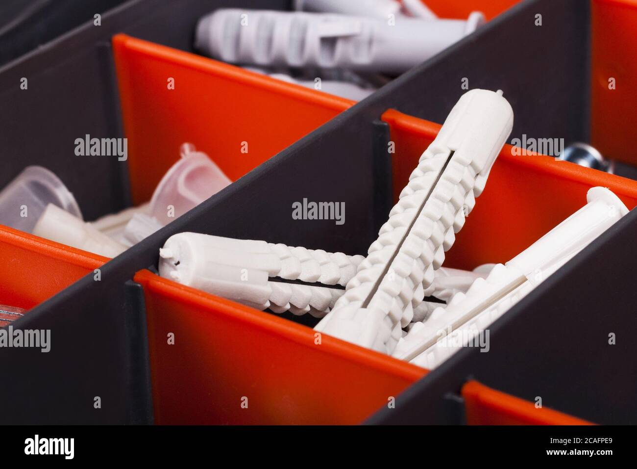 Toolbox with plastic anchors Stock Photo - Alamy