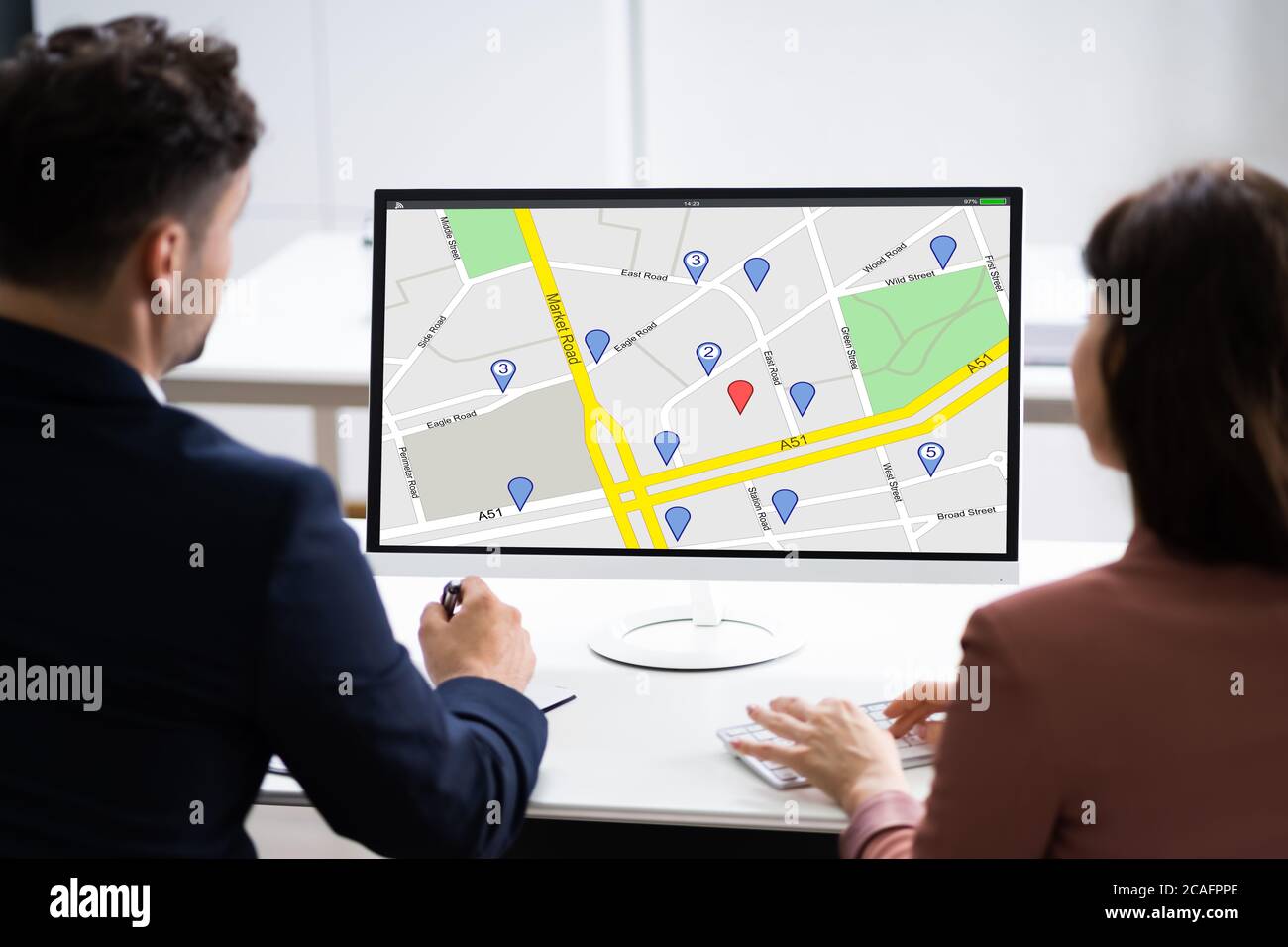 Business People Looking At Online GPS Navigator Location Map Stock ...