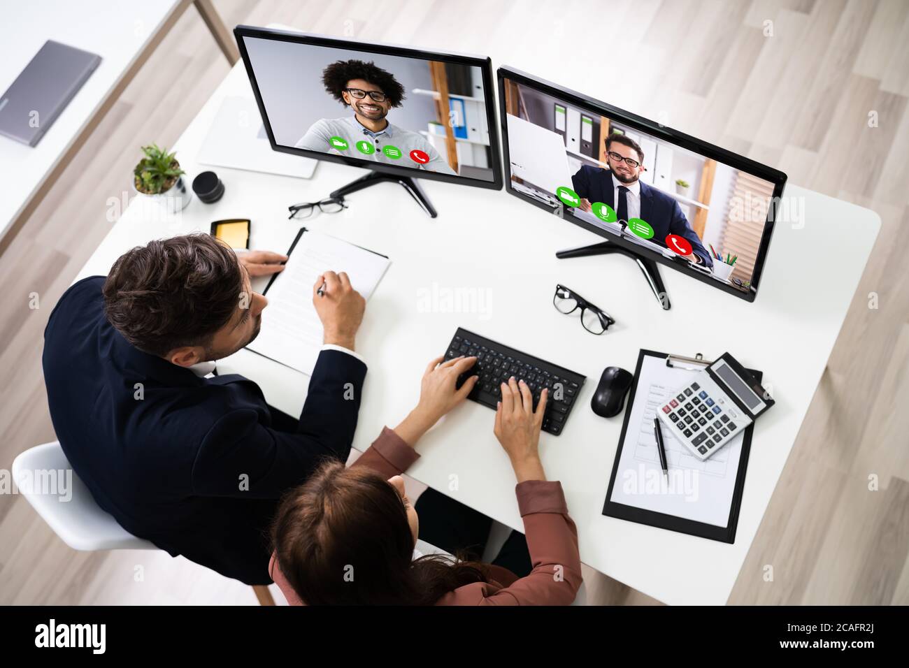 Office employee using videoconference hi-res stock photography and ...