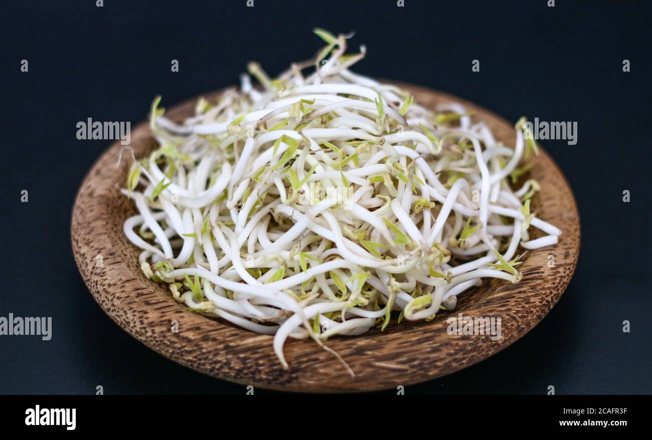 Mung bean sprouts or tauge on black background Stock Photo - Alamy