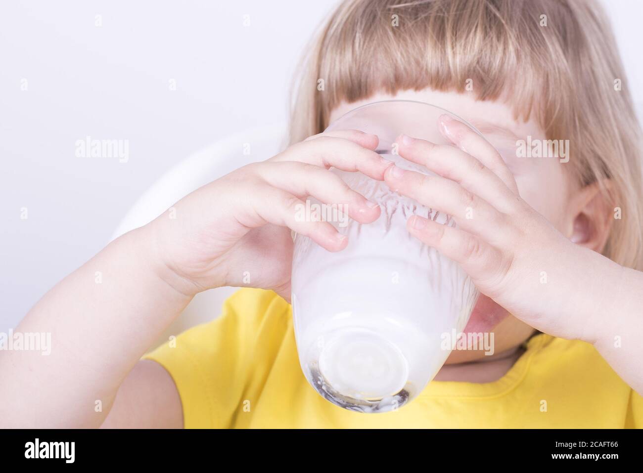 Selective focus shot of a cute happy baby drinking milk Stock Photo - Alamy