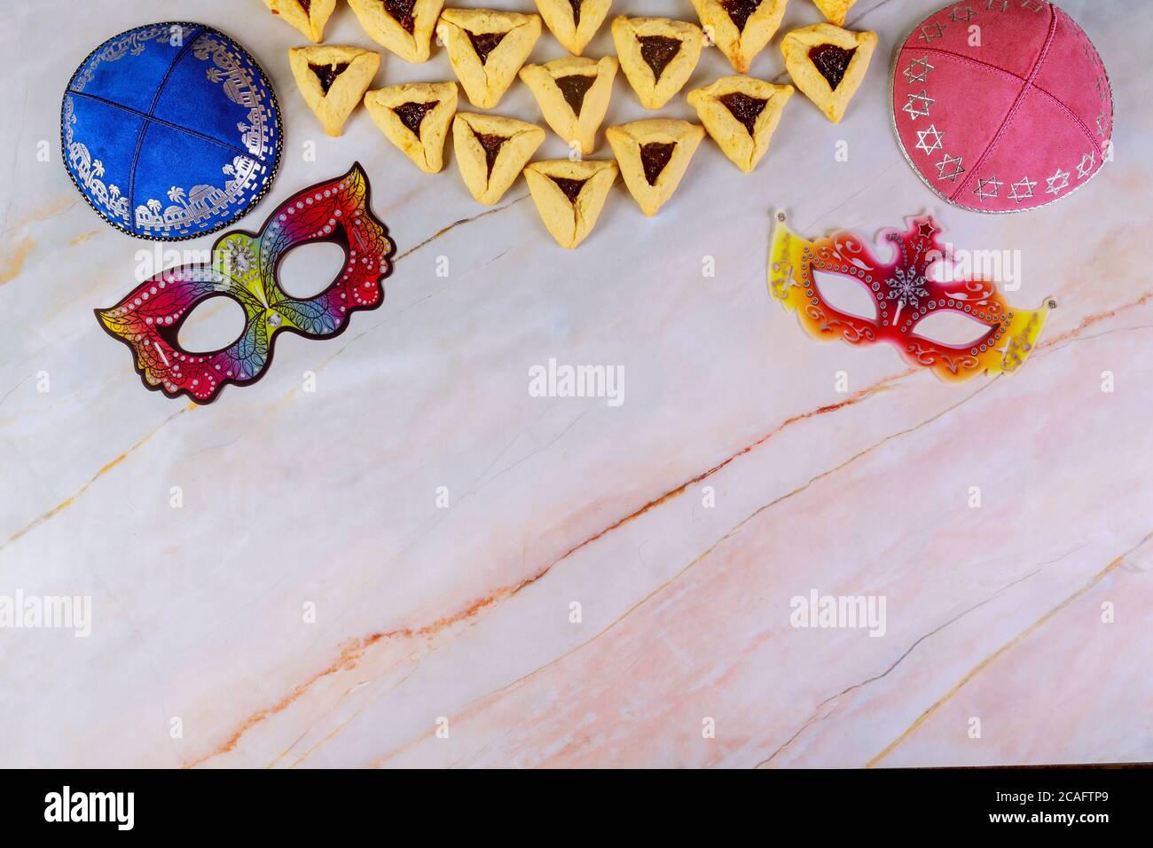 Purim carnival background with blue and pink kippa, masks and ...