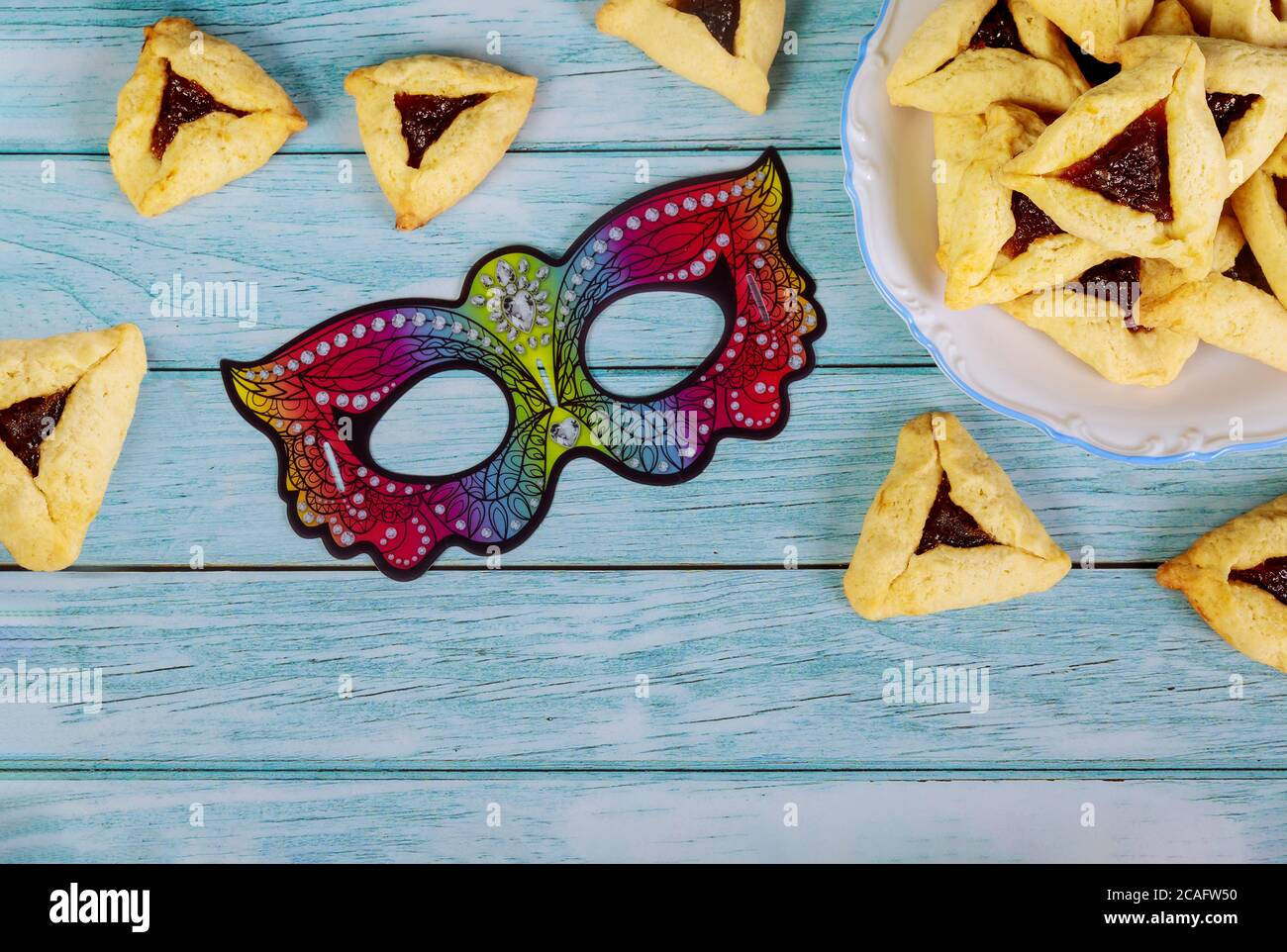 Purim background with mask and hamantaschen triangle cookies Stock ...