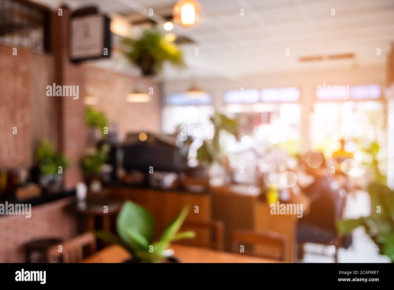 Blur coffee and restutant cafe with customers background vintage tone ...