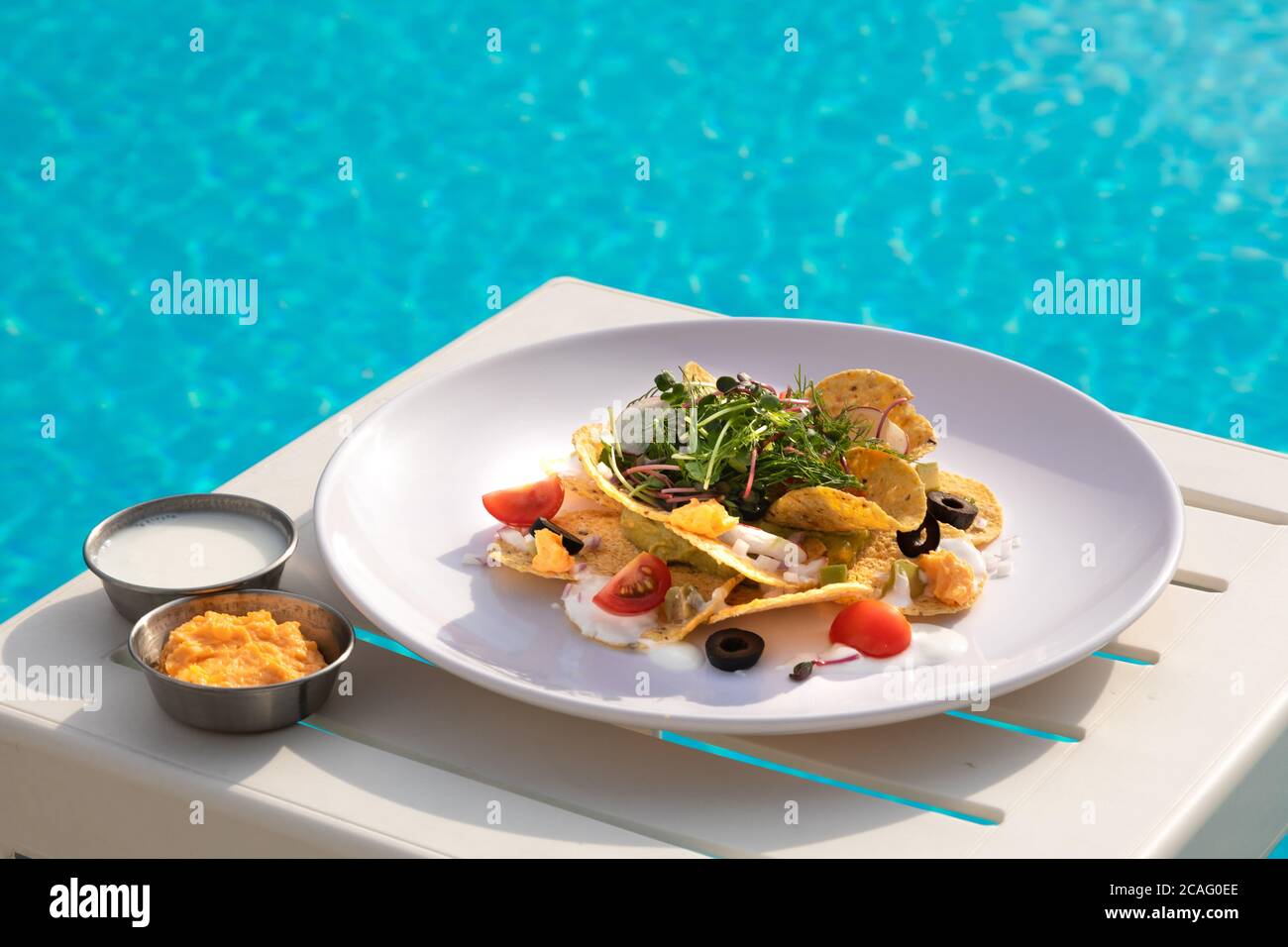 nacho and beer in swimming pool Stock Photo - Alamy