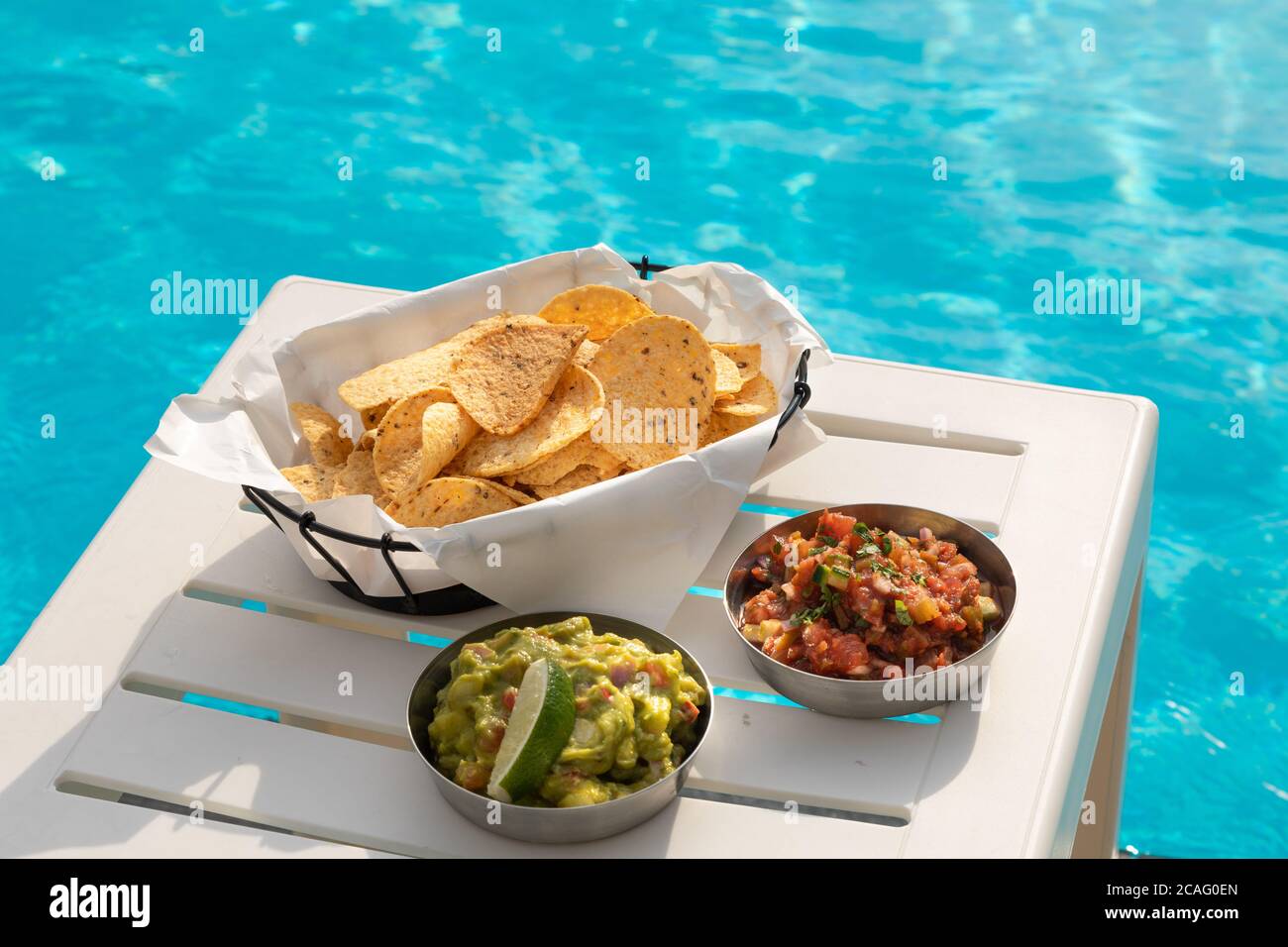 nacho and beer in swimming pool Stock Photo - Alamy
