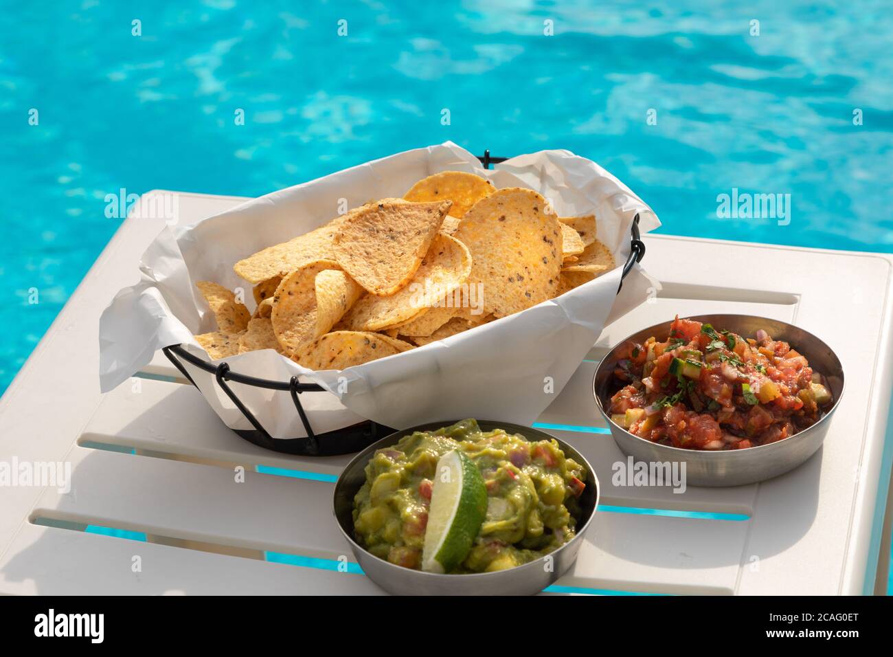 nacho and beer in swimming pool Stock Photo - Alamy
