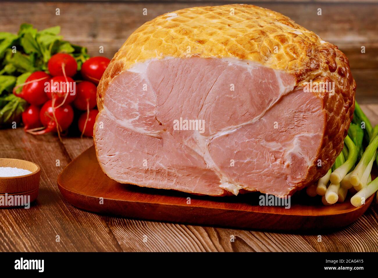 Whole cooked ham with radish, scallion and salt for Easter Stock Photo ...