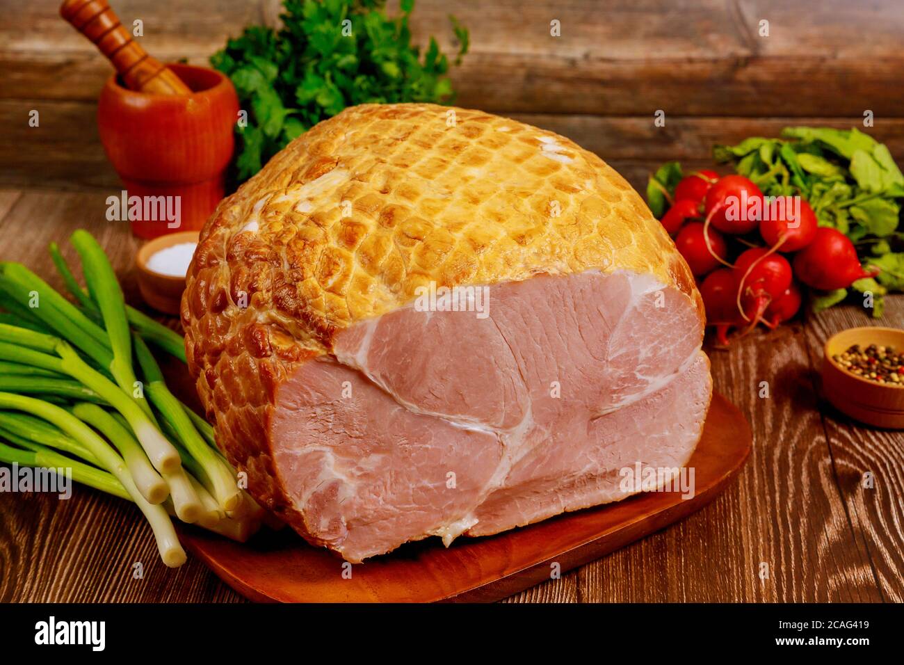 Whole cooked ham with radish, scallion and salt for Easter Stock Photo ...