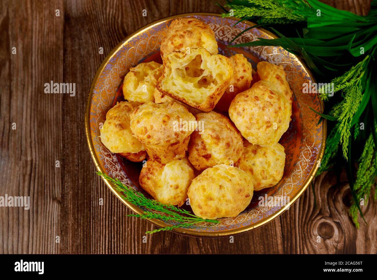Baked brazilian cheese bread made from cassava starch on wooden table ...