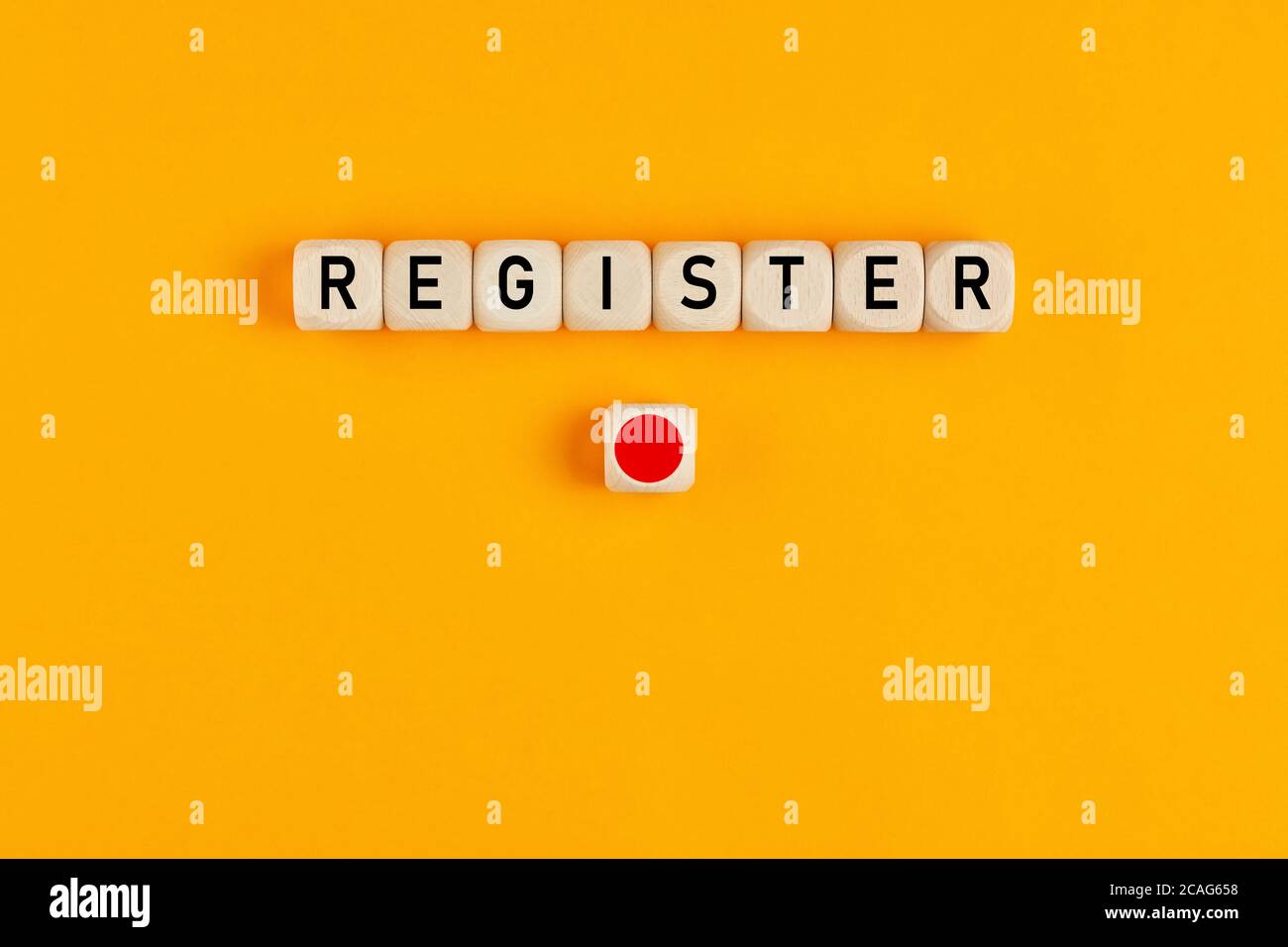 The word register written on wooden cubes with a push button on yellow ...