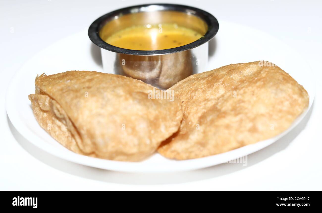 Puri bhaji -An Indian dish consisting of puris and spicy potatoes in ...