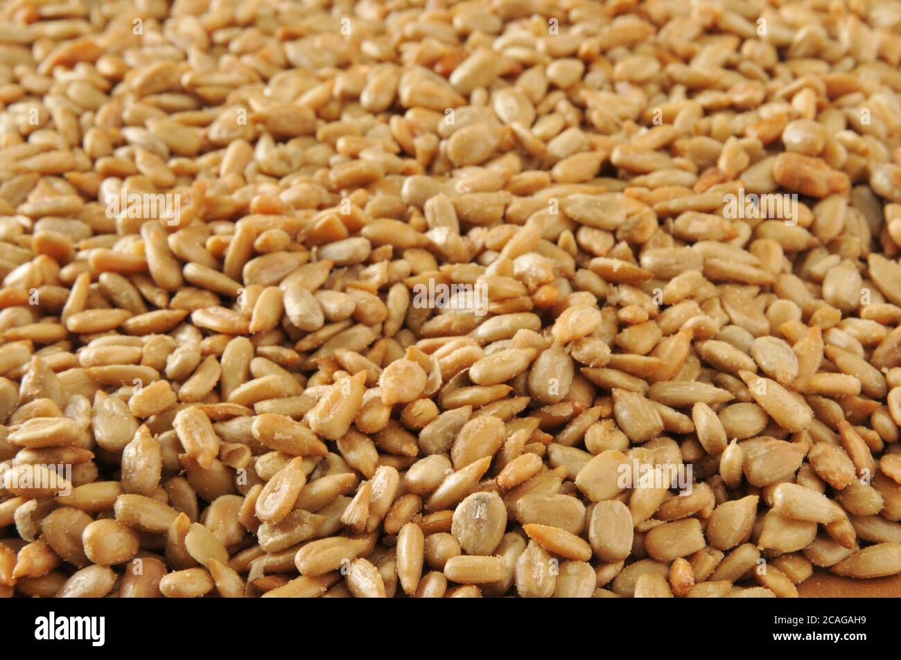 a background of roasted, salted hulled sunflower seeds Stock Photo - Alamy