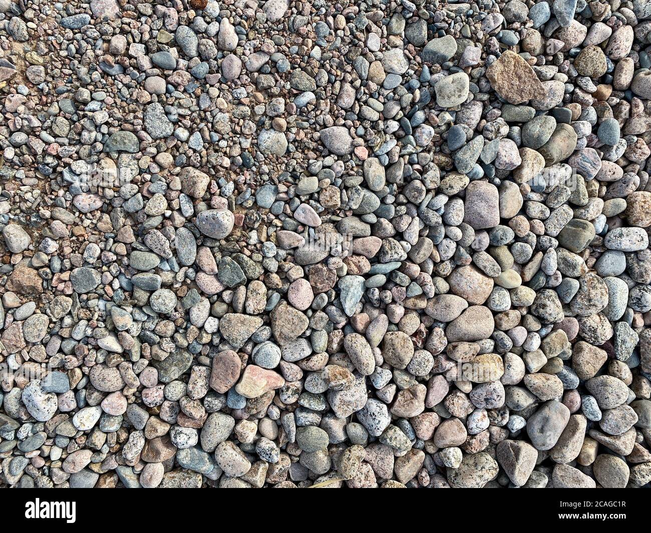 beach pebbles top view background Stock Photo - Alamy