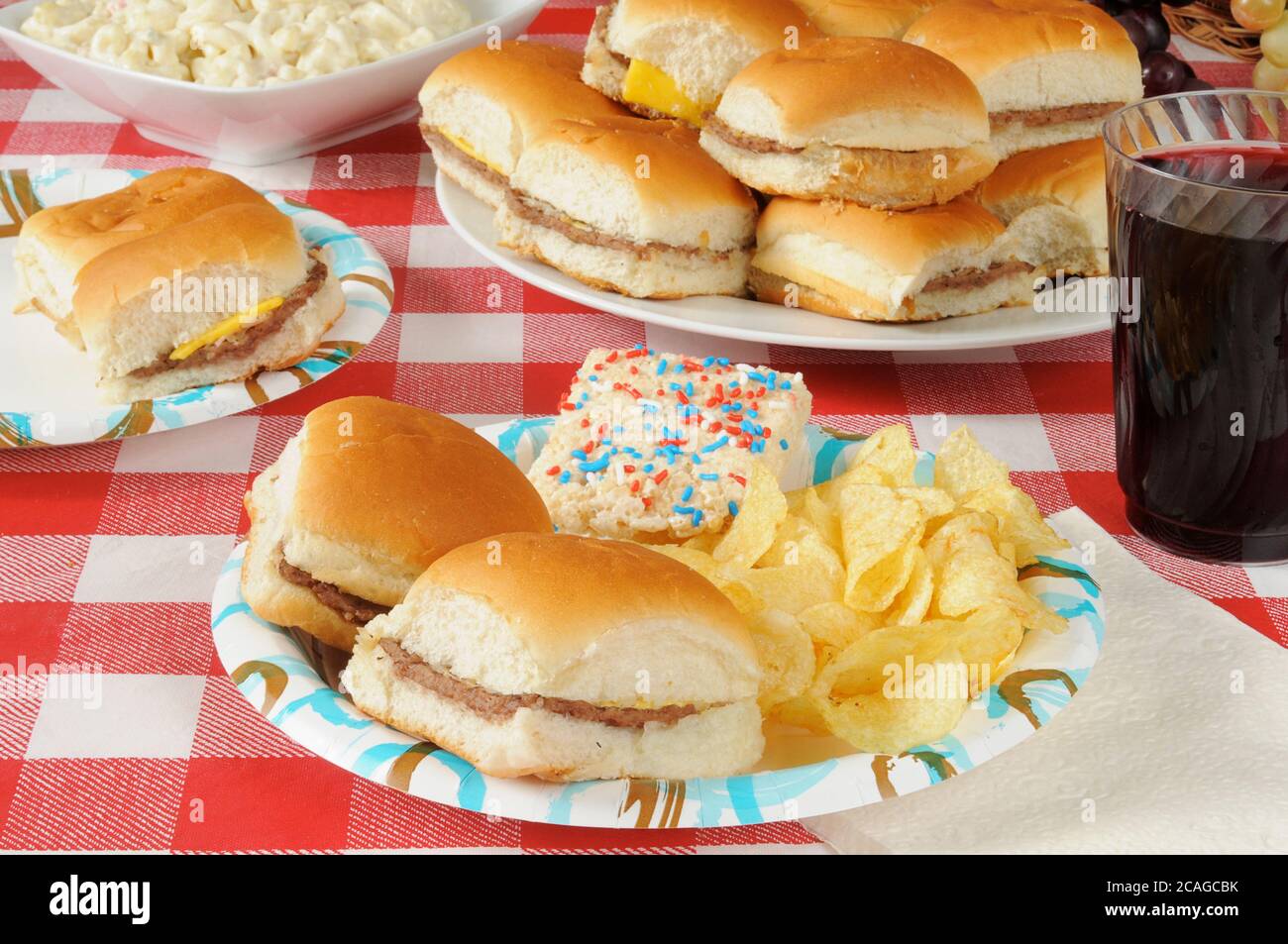 Mini cheeseburgers on a picnic table Stock Photo - Alamy