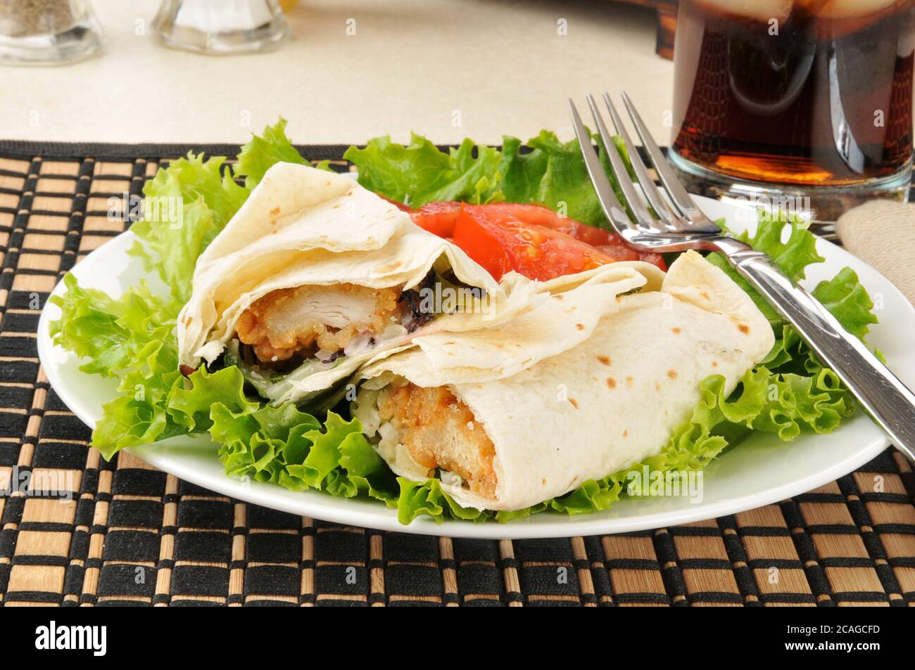 Deep fried breaded chicken wrapped in tortilla shells Stock Photo - Alamy