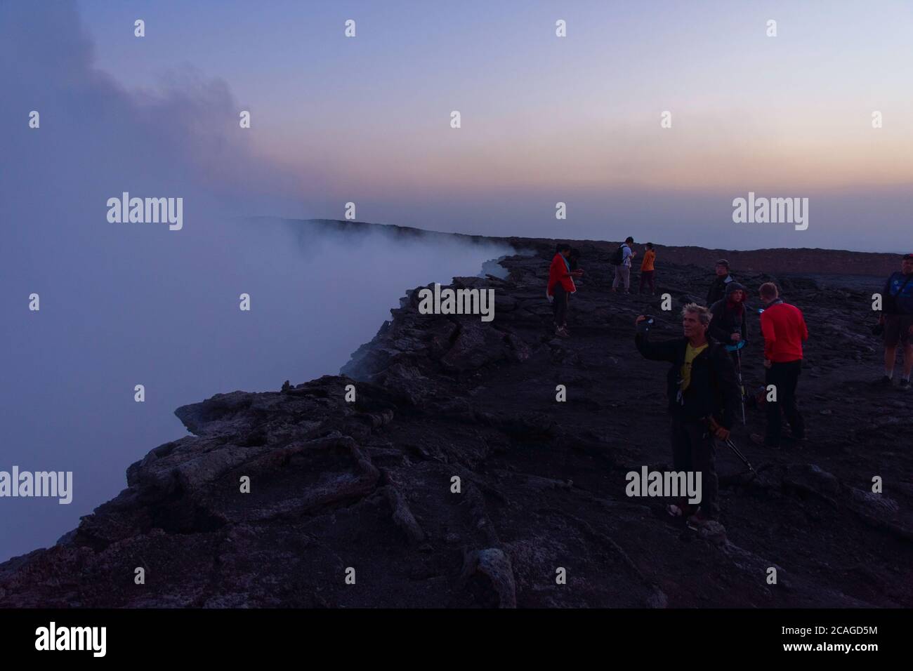 Erta Ale, Ethiopia - Nov 2018: Group of people at the edge of Erta Ale ...