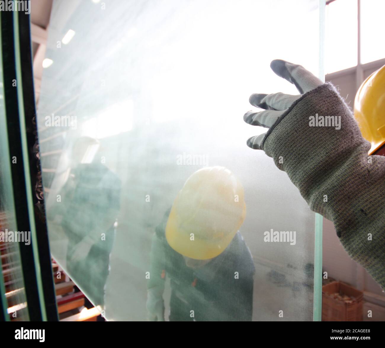 Glass manufacturing factory. Workers in the factory Stock Photo - Alamy