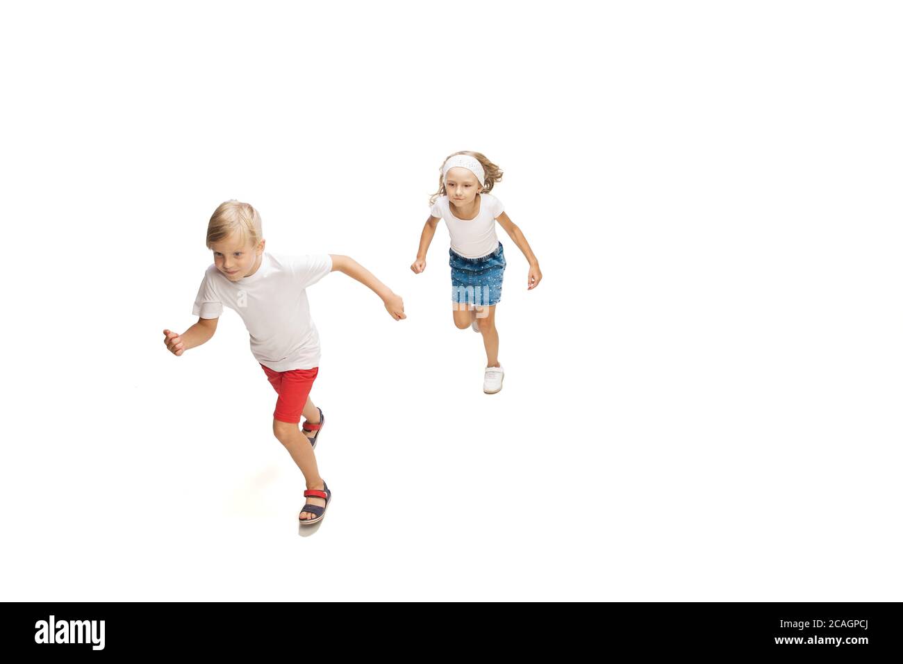 Friendship. Happy kids, little emotional caucasian boy and girl jumping ...