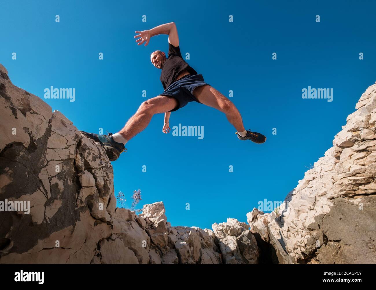 Male athlete jumping during workout hi-res stock photography and images ...