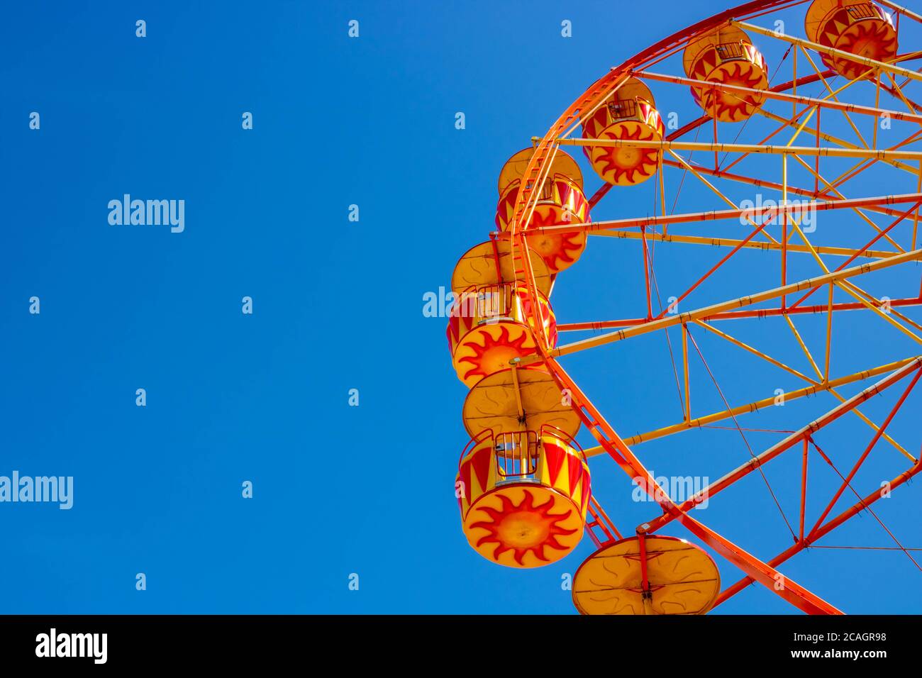 Yellow Ferris Wheel against a blue sky. Space for your text Stock Photo ...