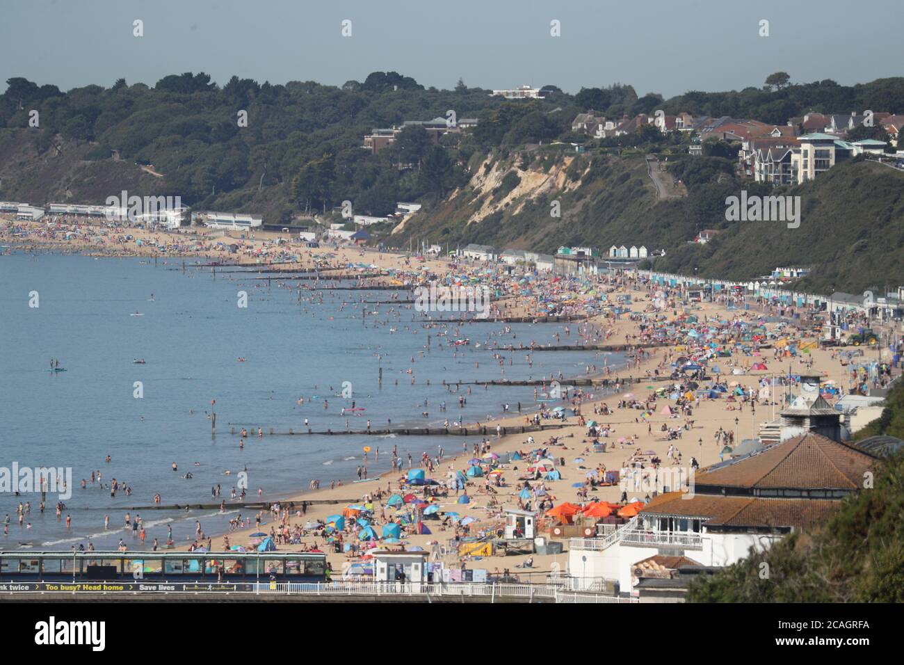 People enjoying the hot weather on bournemouth beach in dorset hi-res ...