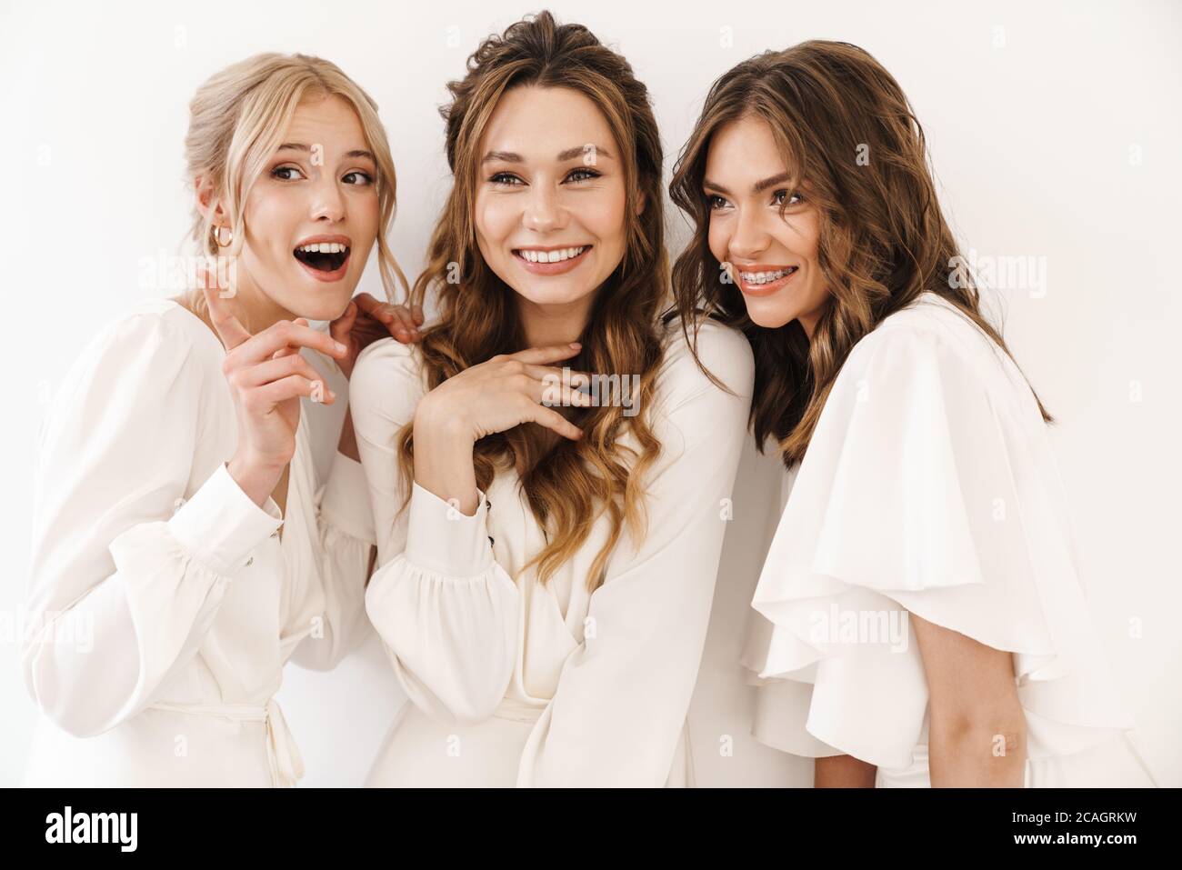 Three girls whispering hi-res stock photography and images - Alamy